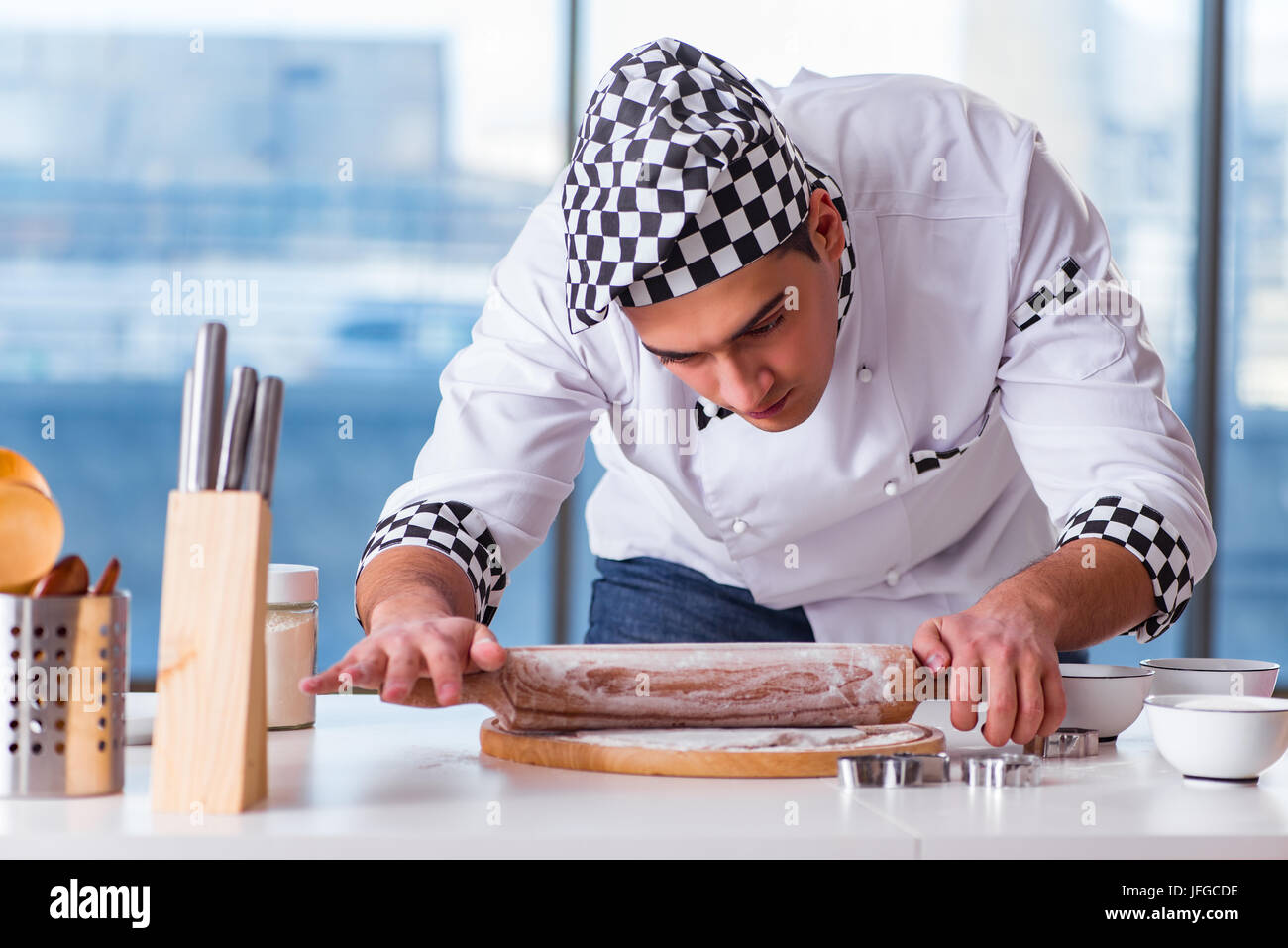 Young man cooking cookies in kitchen Stock Photo - Alamy