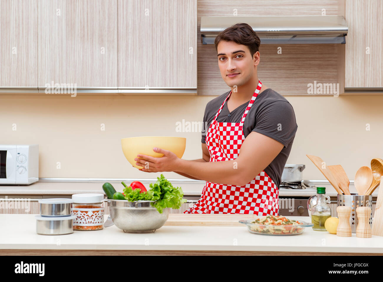 Man male cook preparing food in kitchen Stock Photo - Alamy