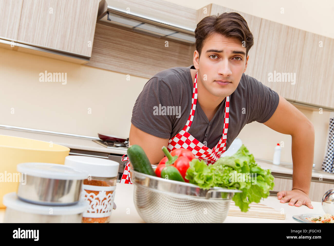 Man male cook preparing food in kitchen Stock Photo - Alamy