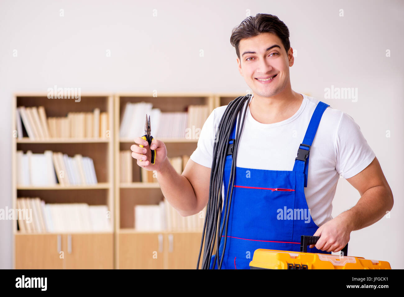 Man doing electrical repairs at home Stock Photo - Alamy
