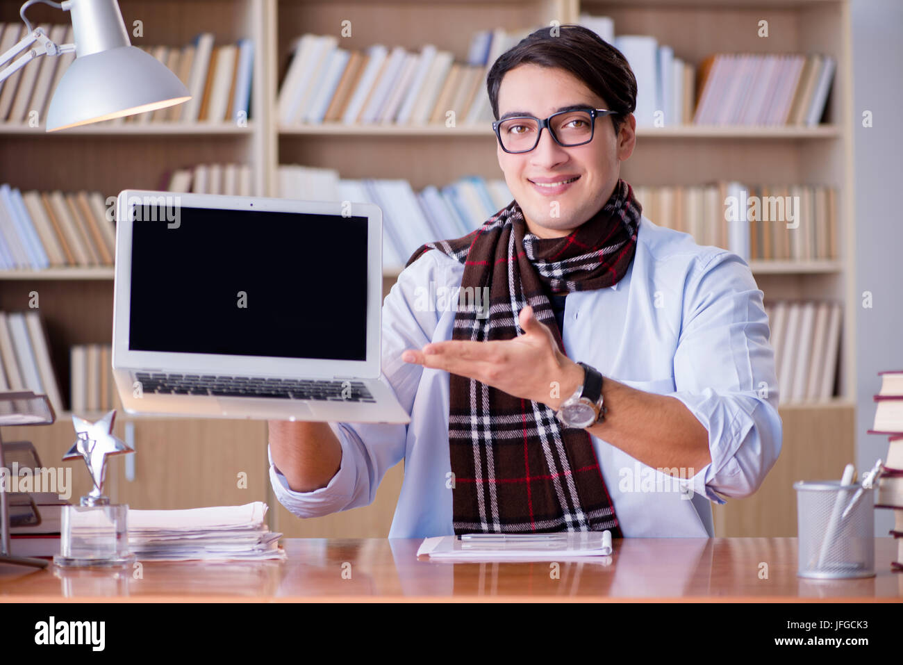 Young writer working in the library Stock Photo - Alamy