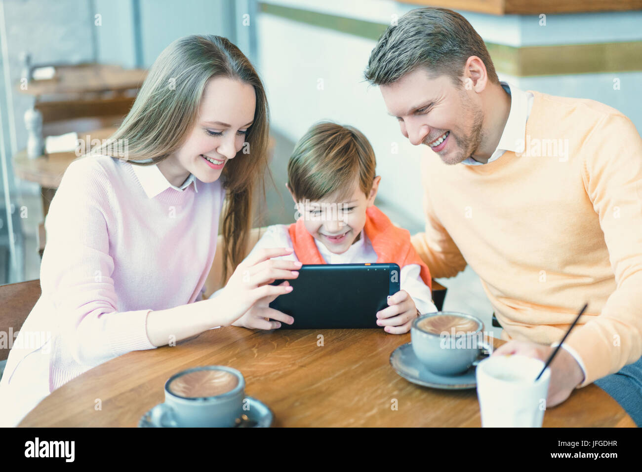 Family in cafe Stock Photo - Alamy