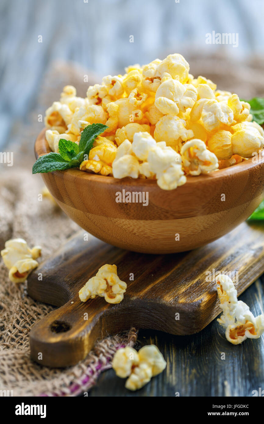 Crispy popcorn in a wooden bowl Stock Photo - Alamy