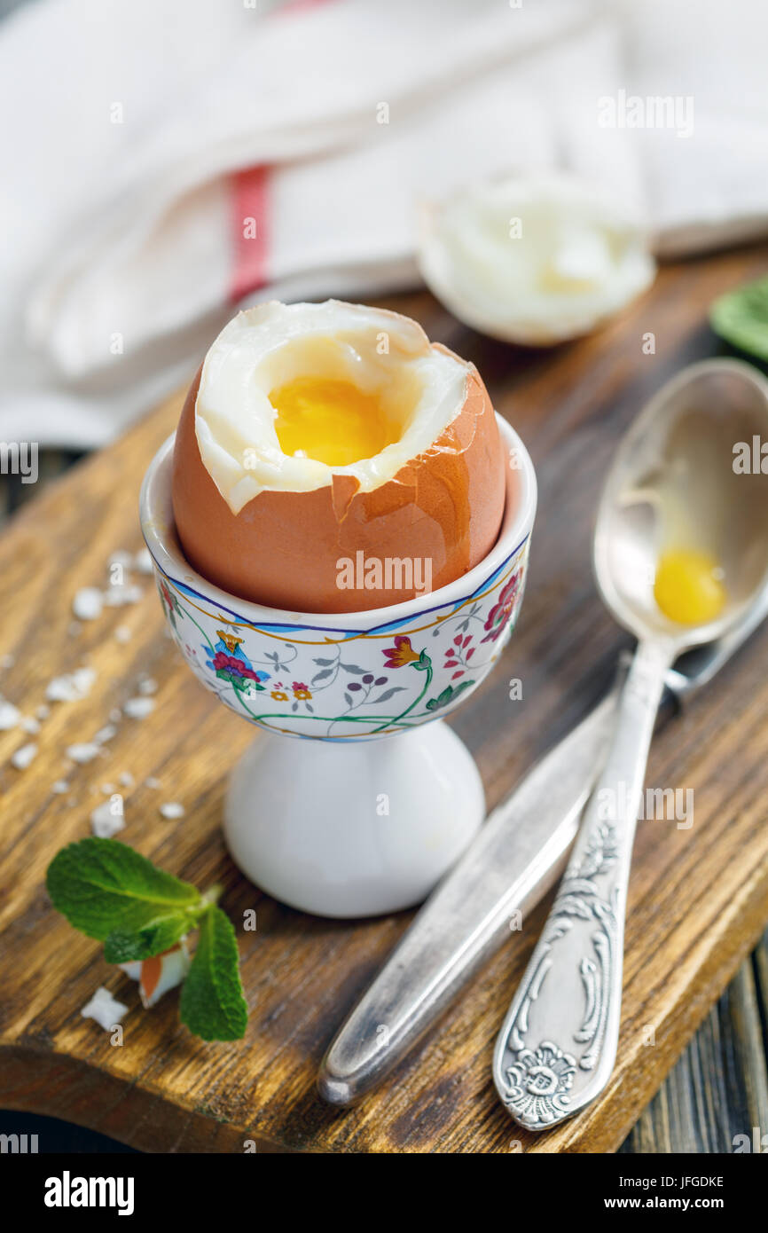 Soft-boiled egg on the stand for breakfast Stock Photo - Alamy