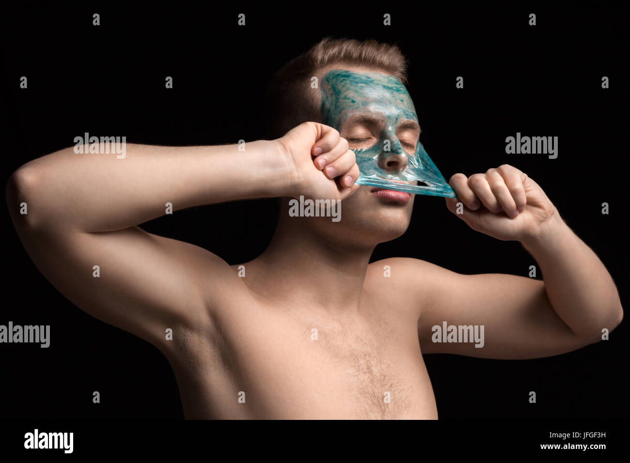 Man peeling off mask hi-res stock photography and images - Alamy
