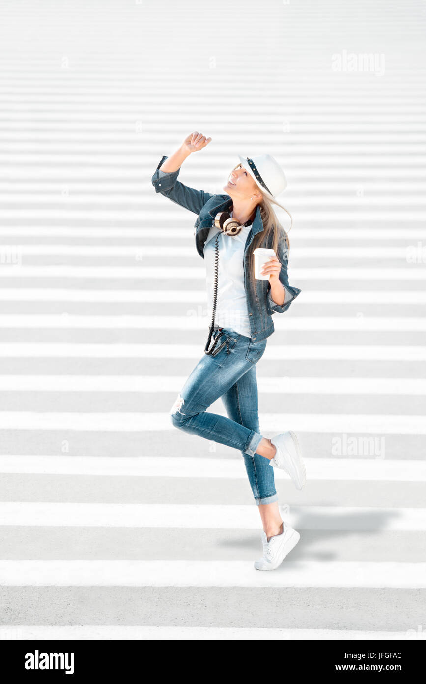 Walking on zebra cross Stock Photo - Alamy