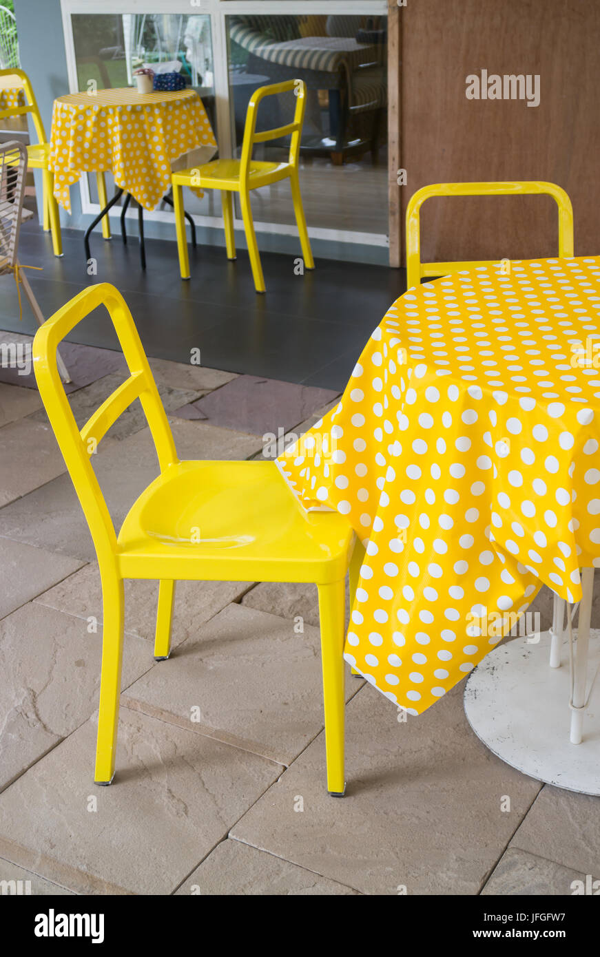 Yellow table and chair in outdoor restaurant garden, stock photo Stock ...