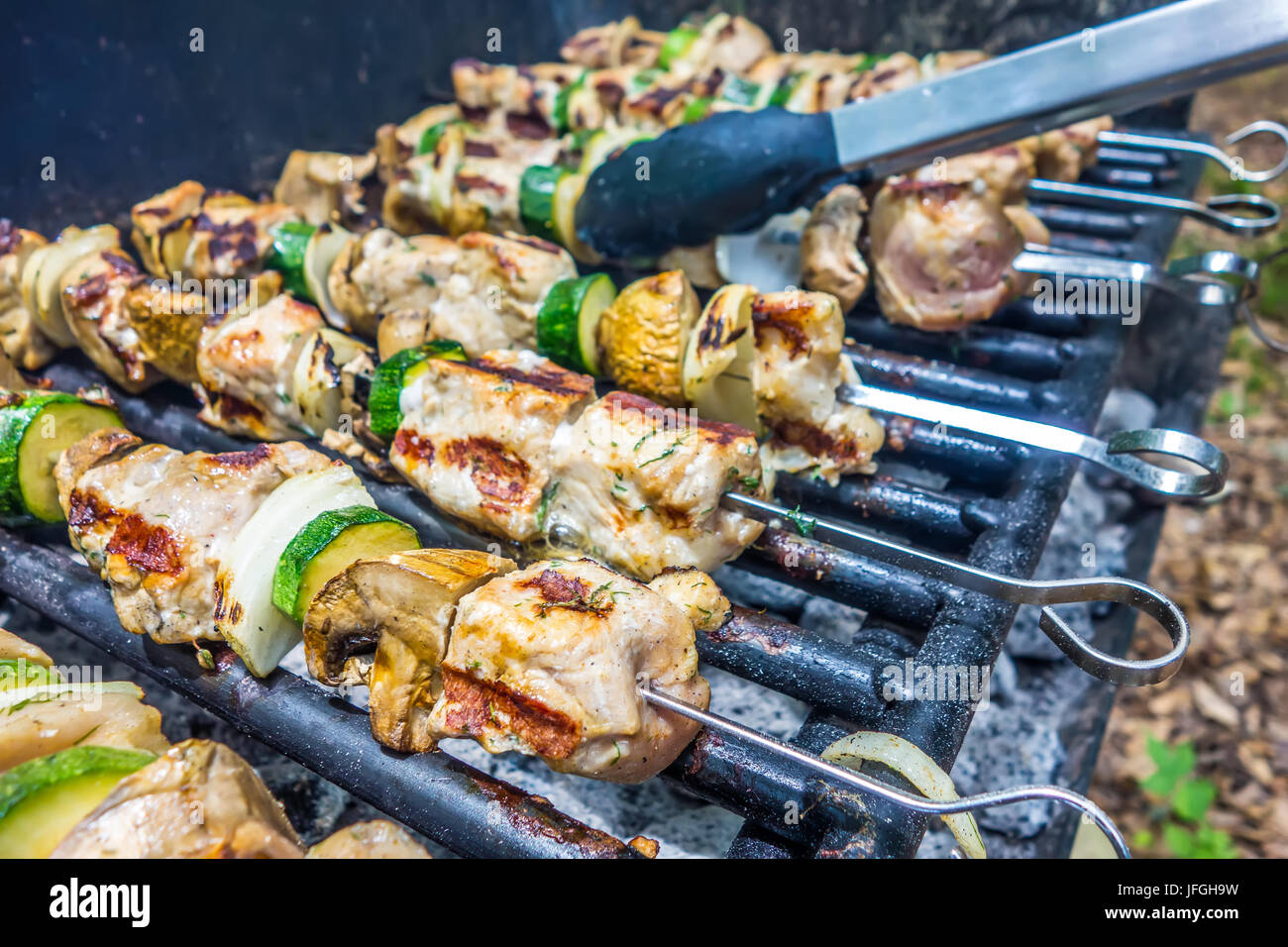 steak shishkabob skewers with vegitables cooking o Stock Photo - Alamy