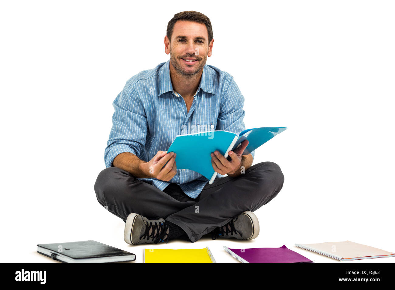 Sitting on floor notepad hi-res stock photography and images - Alamy