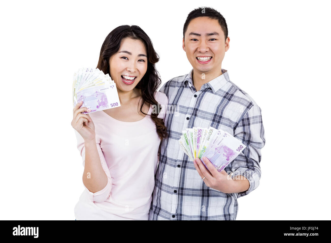 Portrait of happy cheerful couple holding money Stock Photo - Alamy