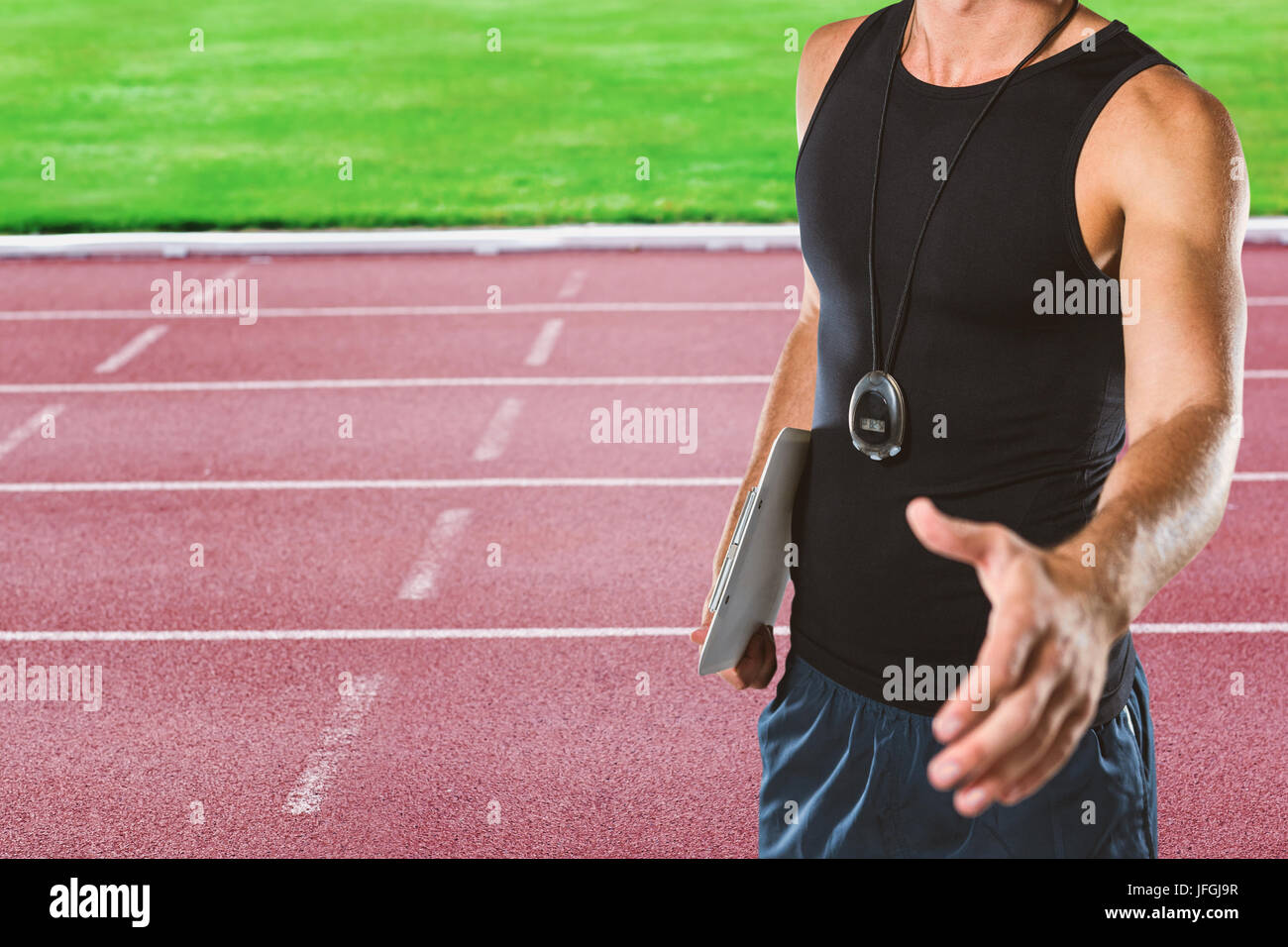 Composite image of personal trainer giving handshake Stock Photo - Alamy
