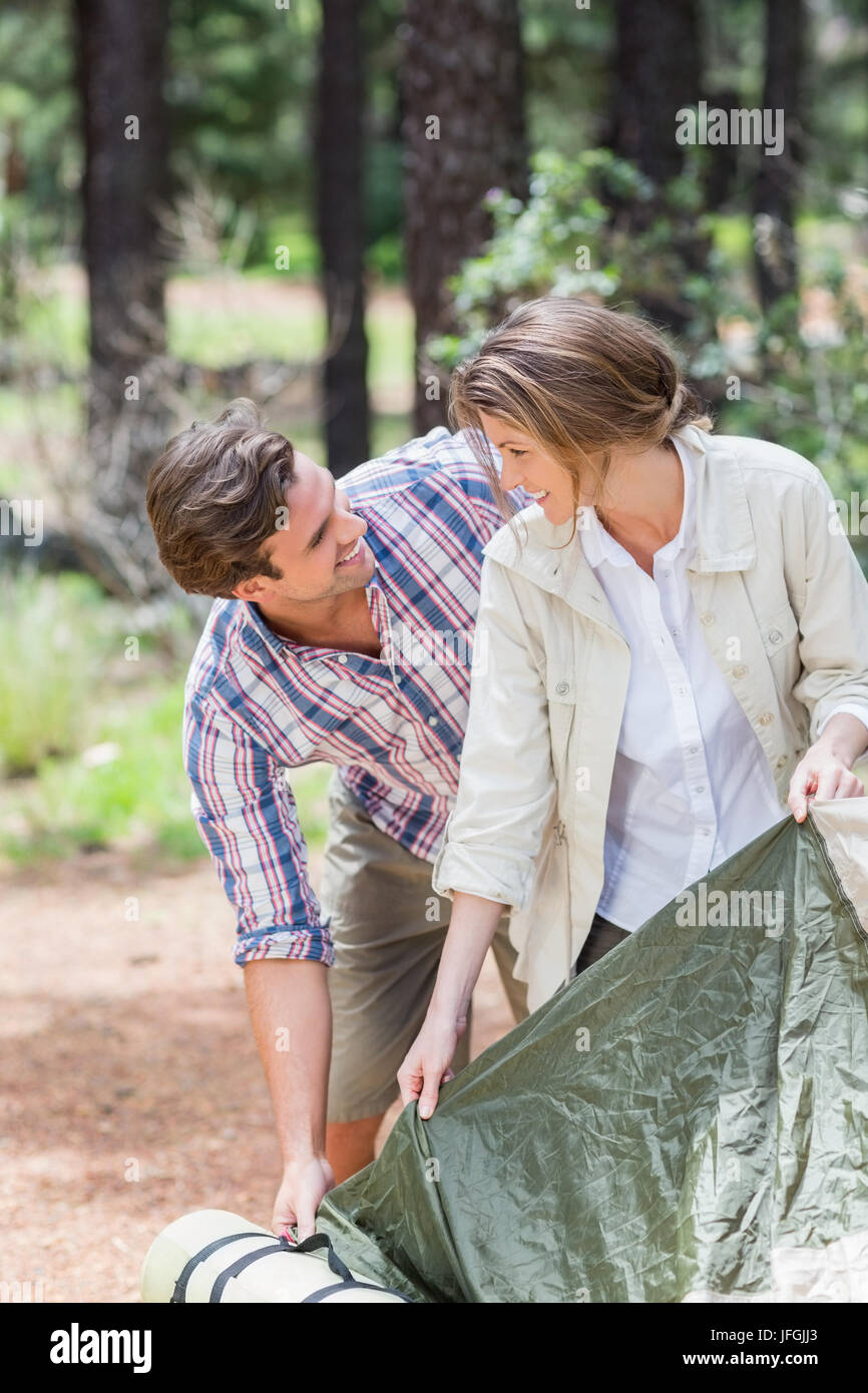 Happy couple looking face to face while tenting Stock Photo - Alamy