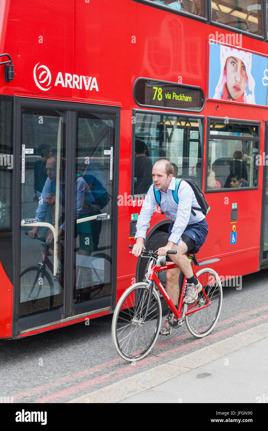 Cyclist with bus hi-res stock photography and images - Alamy