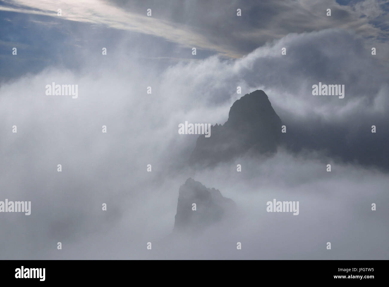 rock summits rise blurred from the sea of clouds, Scharnitzspitze and ...