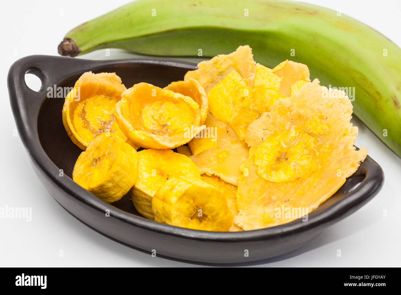 Raw plantain cups, patacones and pieces on white background Stock Photo ...