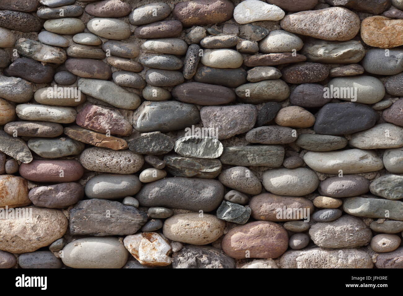 pebble stones wall Stock Photo - Alamy