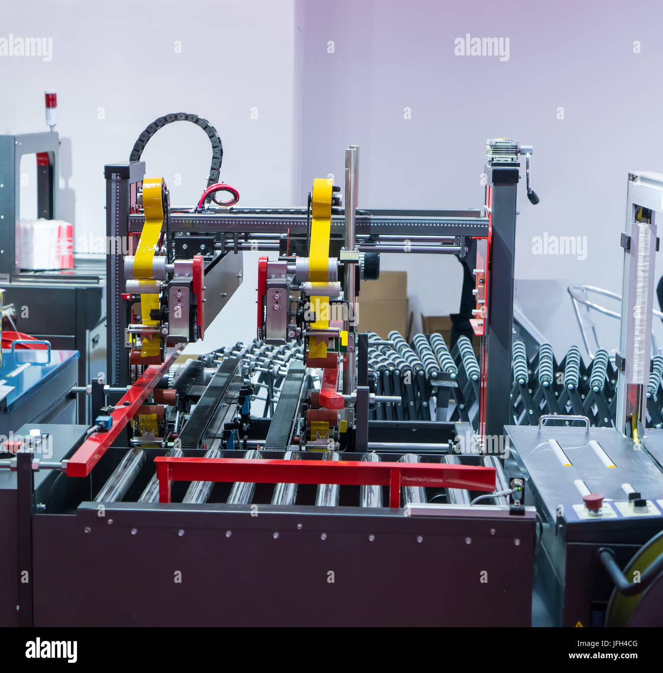 Robotic arm at production line with automatic conveyor belt, industry ...