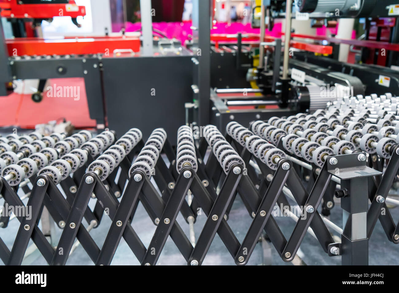Robotic arm at production line with automatic conveyor belt, industry ...