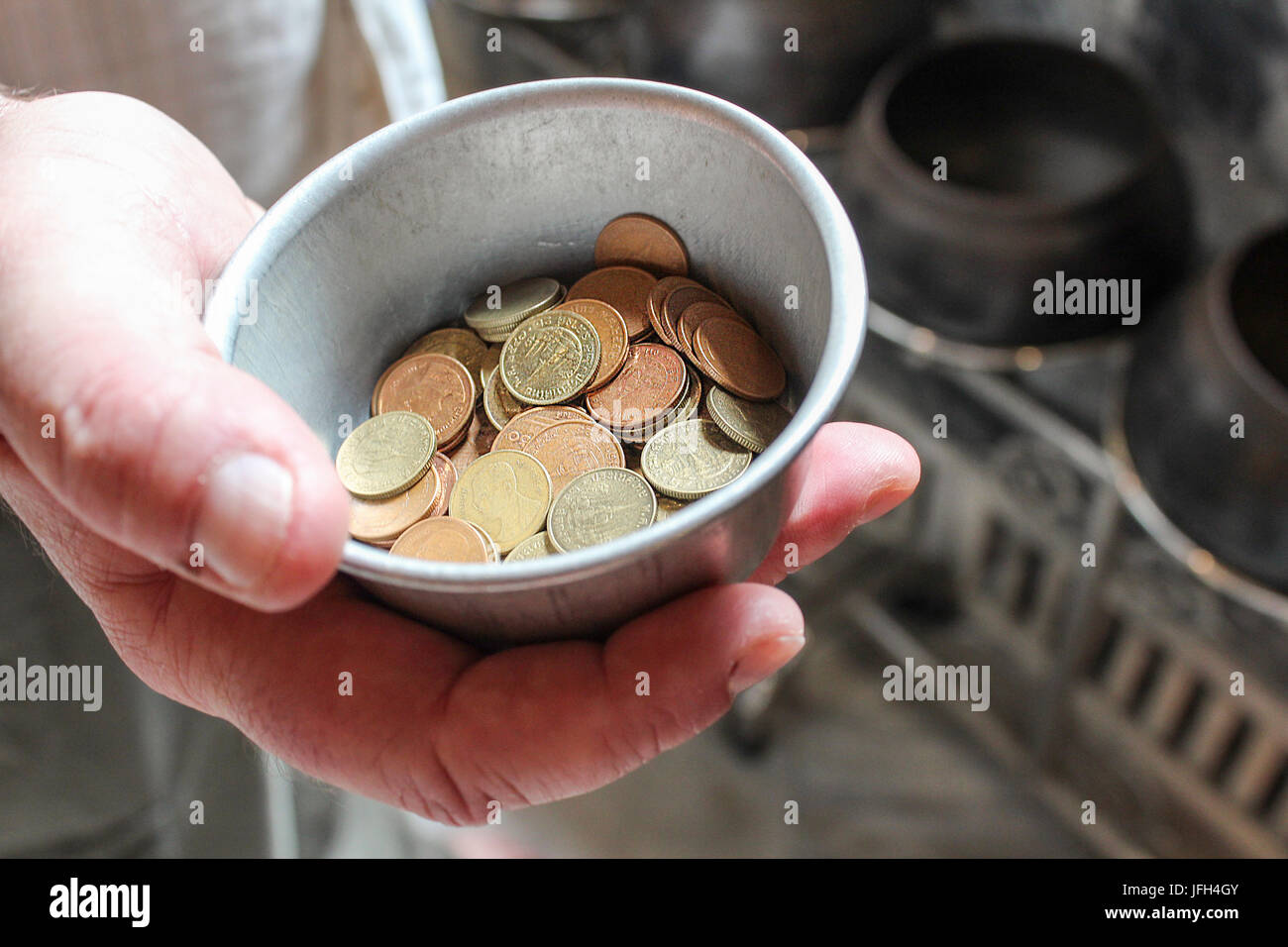 Begging bowl hi-res stock photography and images - Alamy