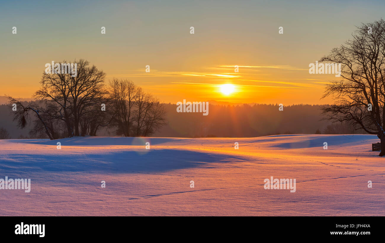 Scenic view of sunset and snow field Stock Photo - Alamy