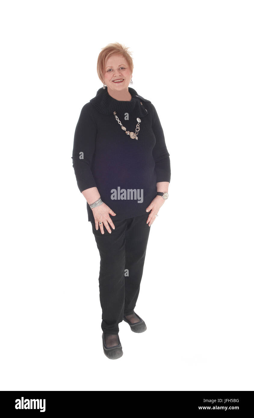 Senior citizen woman standing smiling Stock Photo - Alamy