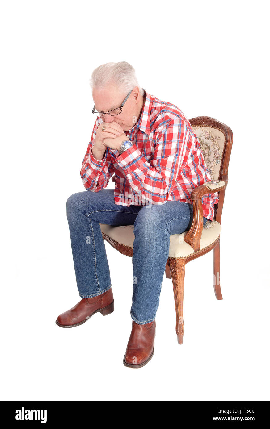 Senior man sitting and thinking Stock Photo - Alamy
