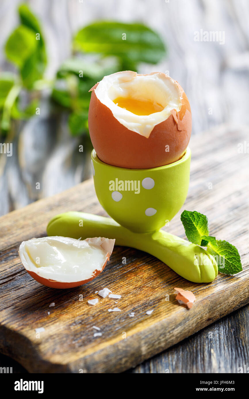 Soft-boiled egg in the green stand Stock Photo - Alamy
