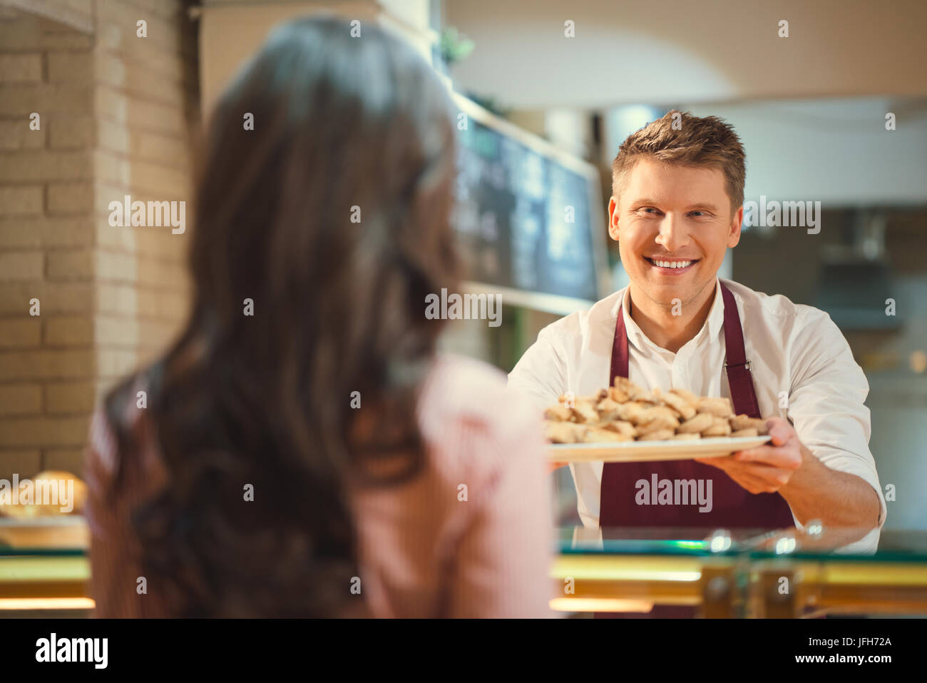Baker and customer Stock Photo - Alamy