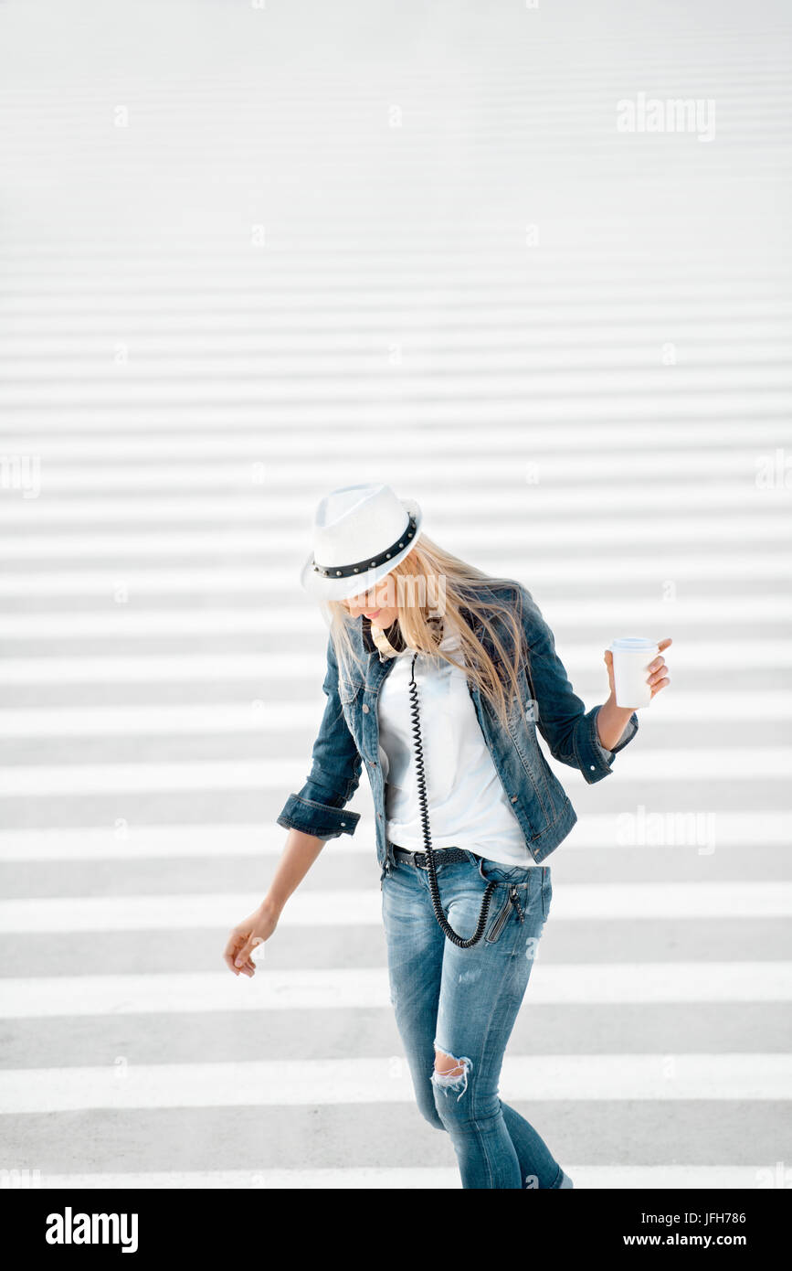 Walking on zebra cross Stock Photo - Alamy
