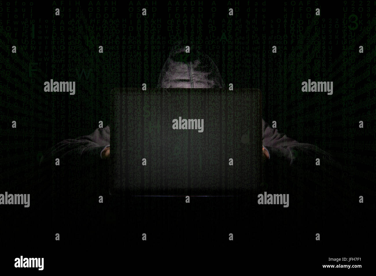 Hacker in a dark room using a laptop, internet phishing, hacking, and ...