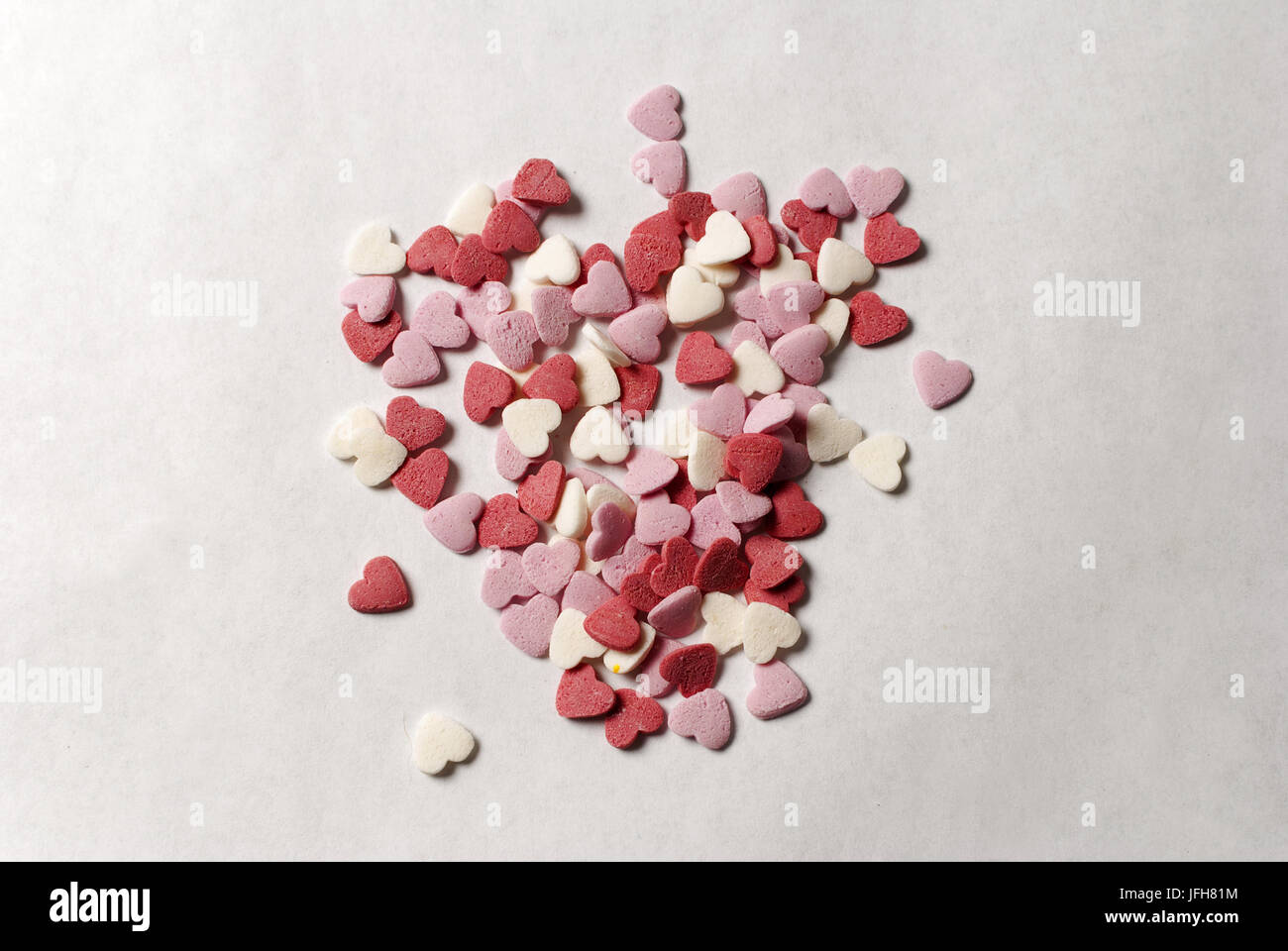 Sugar hearts on a white background Stock Photo - Alamy