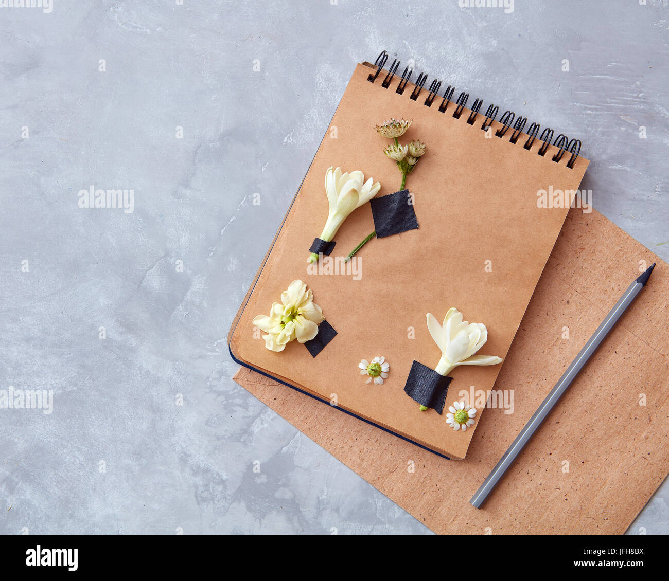 Notebook with pencil Stock Photo - Alamy