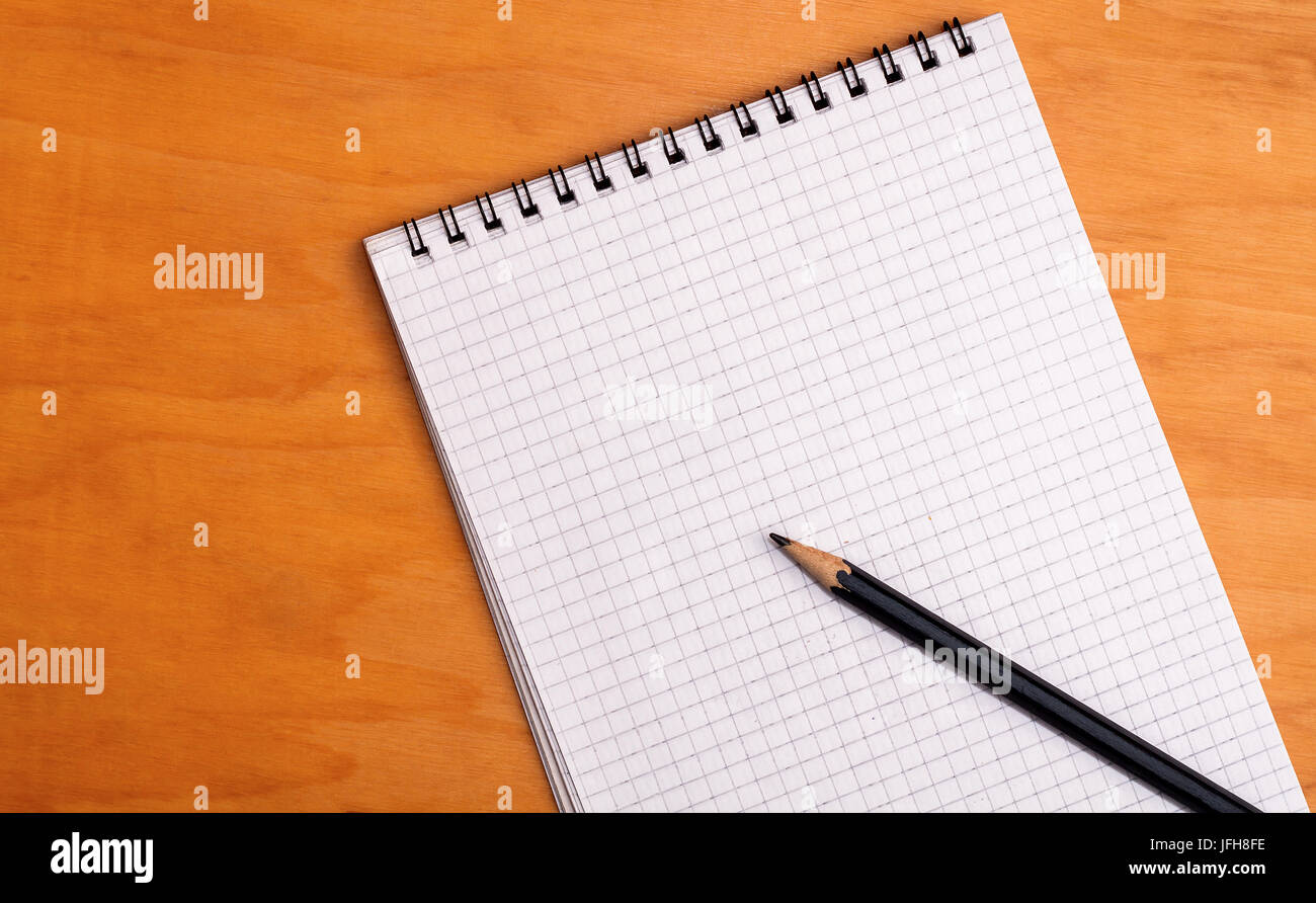 Pencil and notebook Stock Photo - Alamy