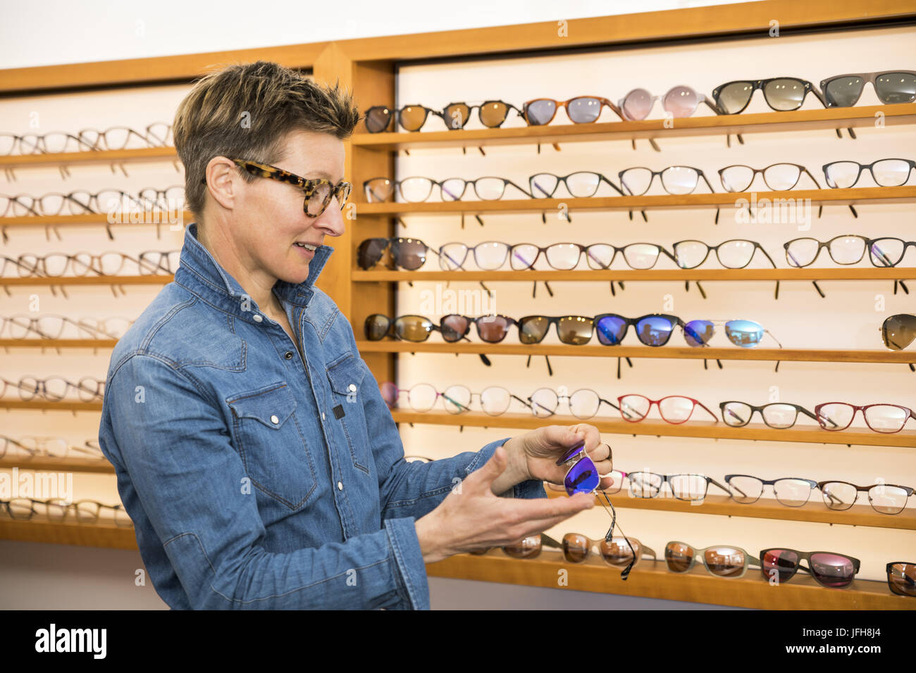 Wearing new eyewear woman hi-res stock photography and images - Alamy