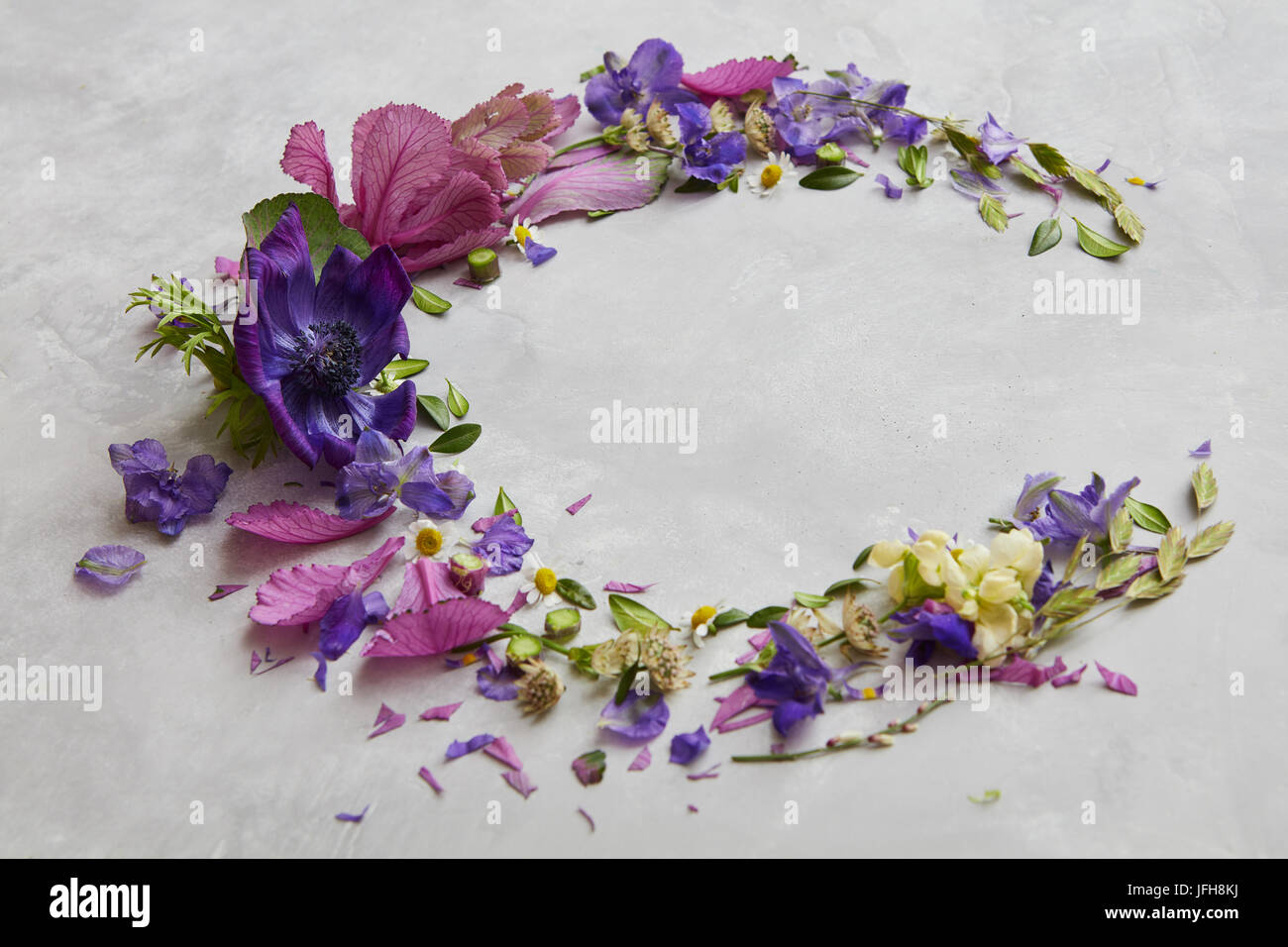 Composition of flowers on grey background Stock Photo - Alamy