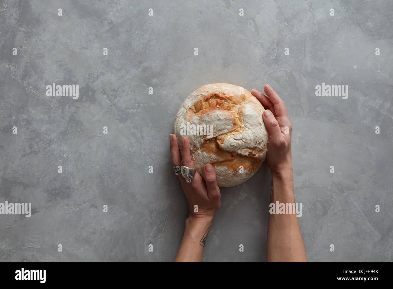 man holding tasty fresh bread Stock Photo - Alamy