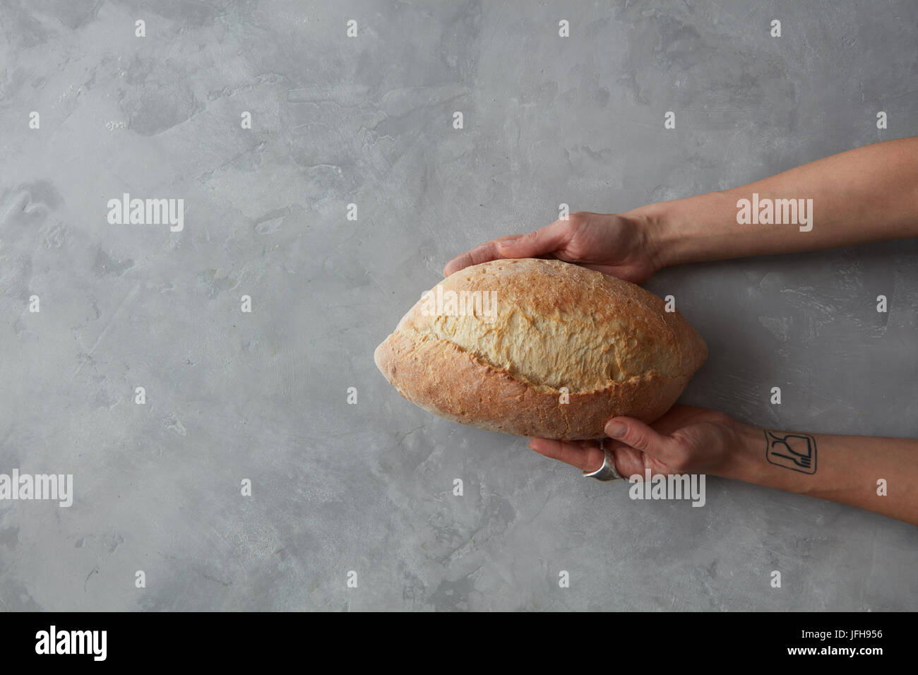 man holding tasty fresh bread Stock Photo - Alamy