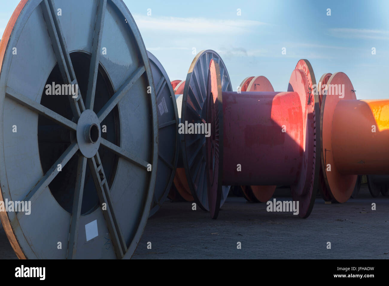 View of empty cable spools Stock Photo - Alamy