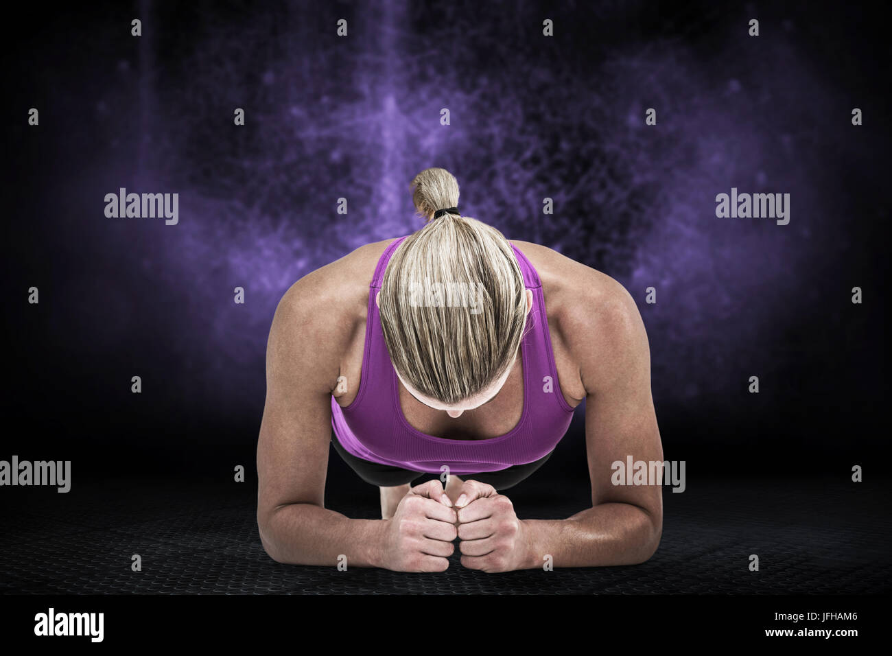 Composite image of muscular woman doing push ups Stock Photo - Alamy