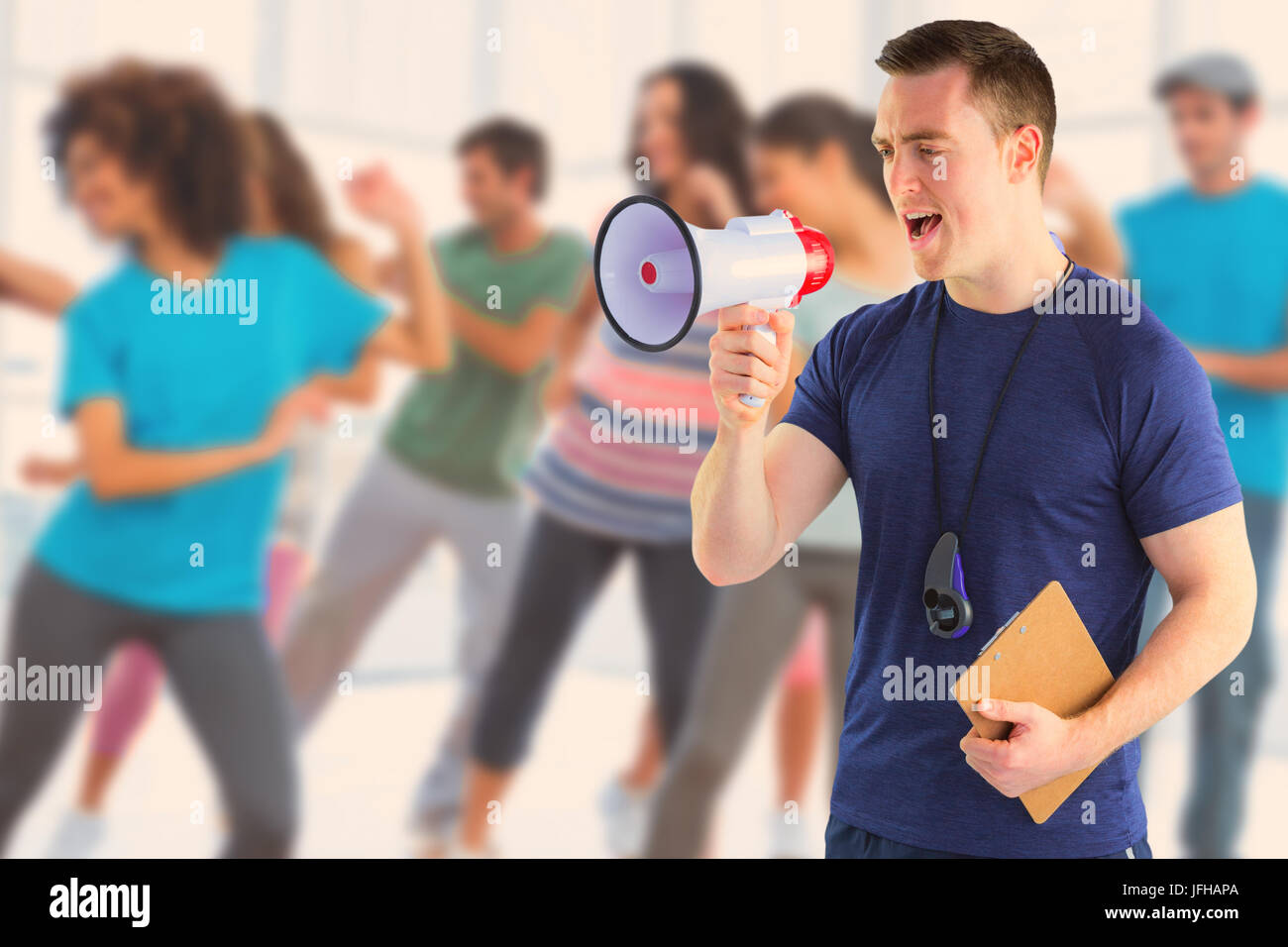 Composite image of male trainer yelling through the megaphone Stock ...