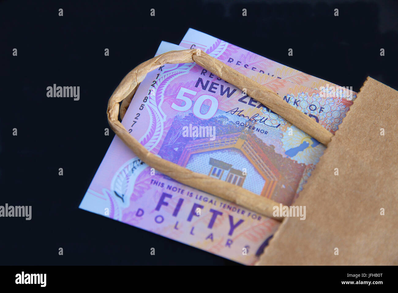 New Zealand fifty dollar notes in a bag Stock Photo - Alamy