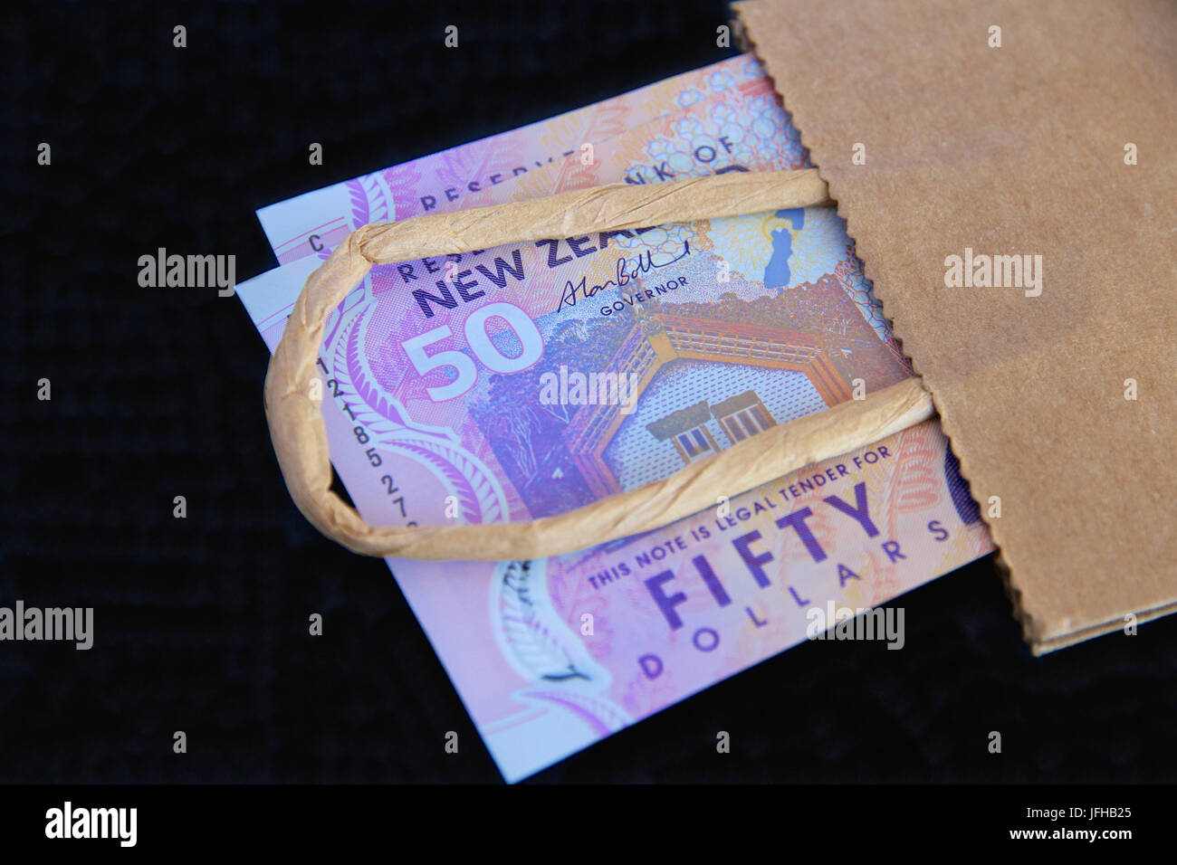 New Zealand fifty dollar notes in a bag Stock Photo - Alamy