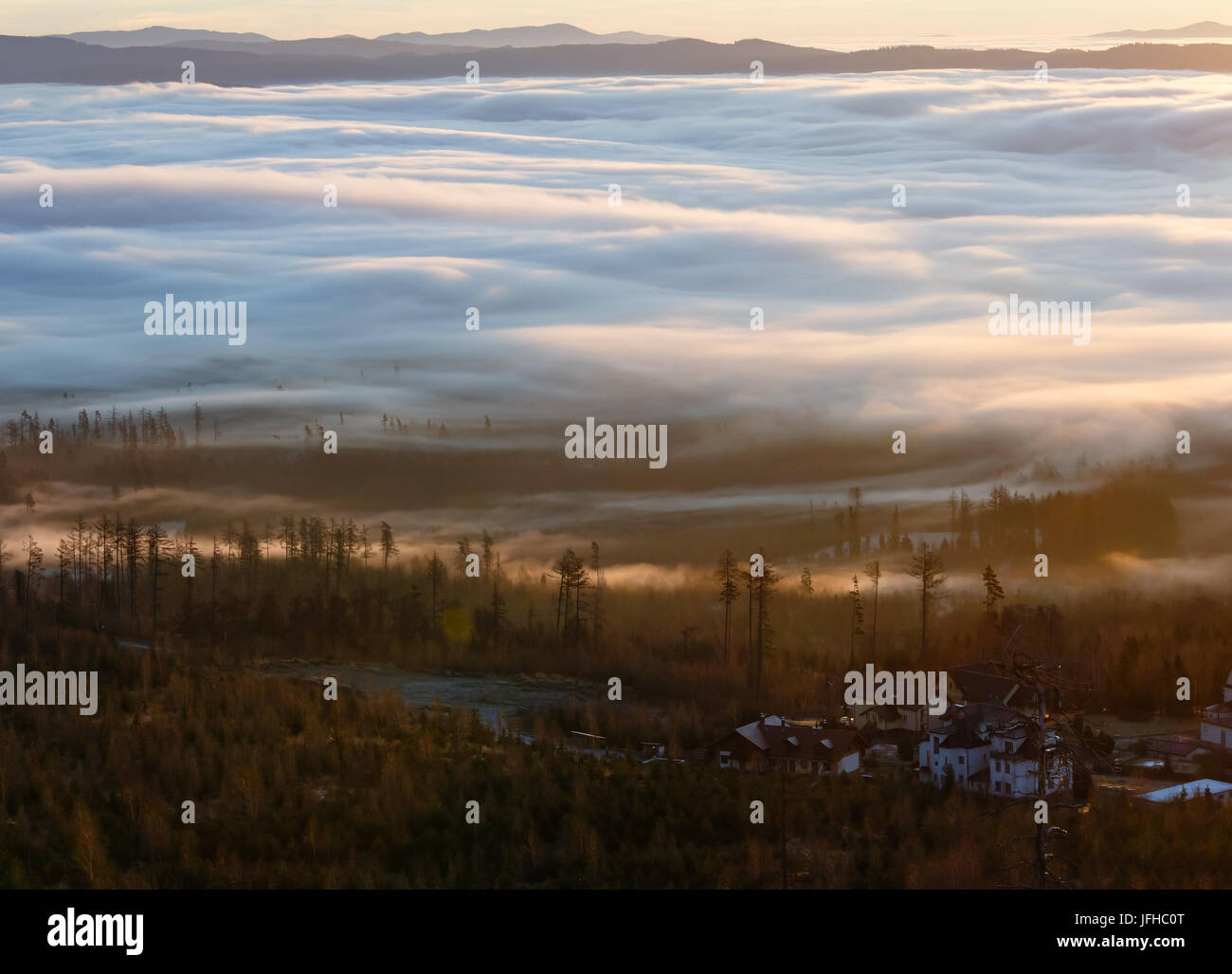 Clouds illuminated by morning sun over valley Stock Photo - Alamy