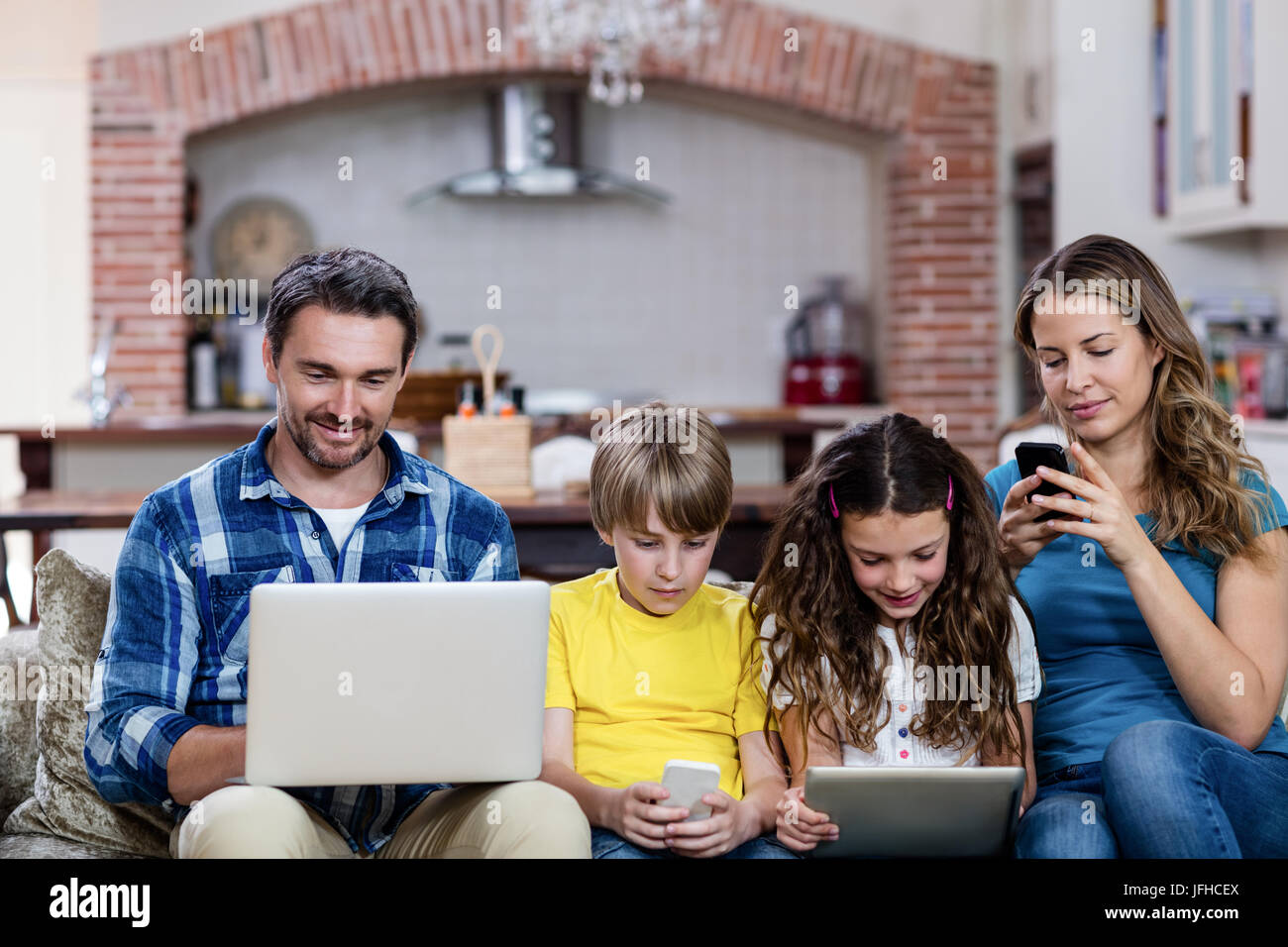 Kids phone laptop hi-res stock photography and images - Alamy