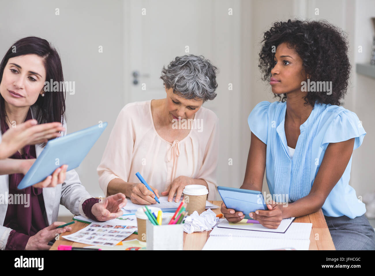 Group of interior designers interacting with each other Stock Photo - Alamy