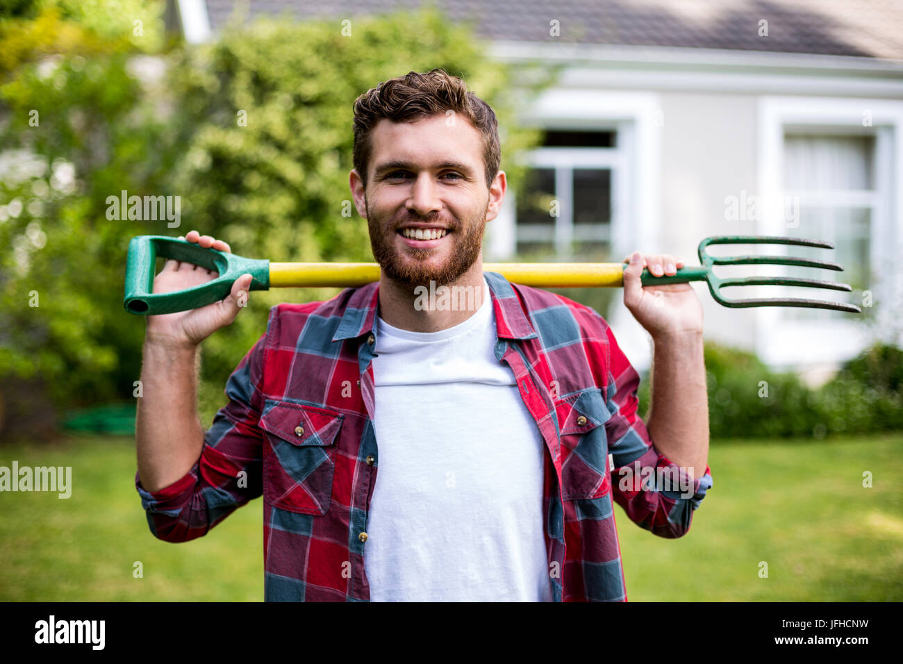 Man standing in grass rake hi-res stock photography and images - Alamy