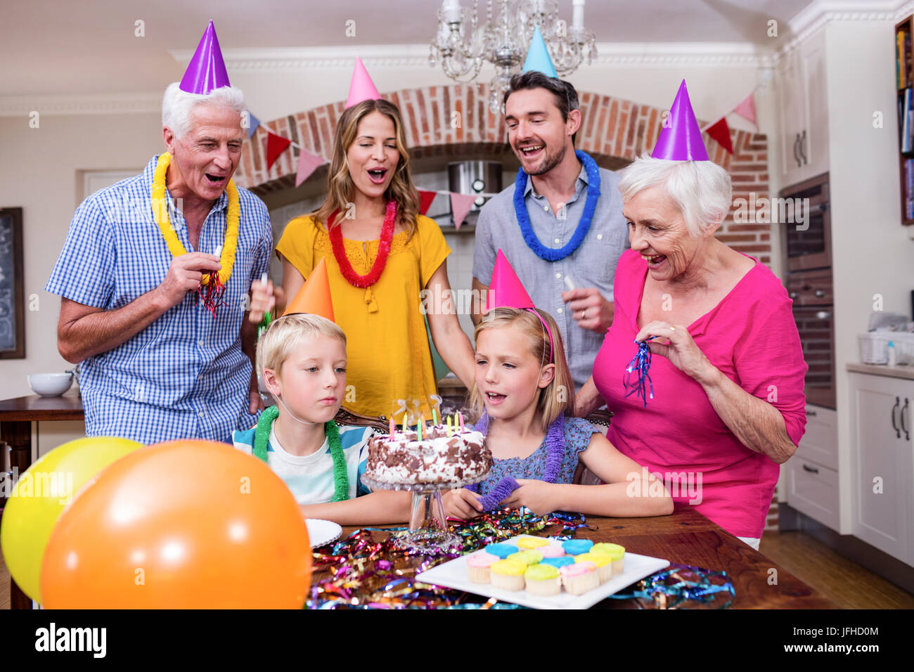 Multi-generation family having fun at birthday party Stock Photo - Alamy