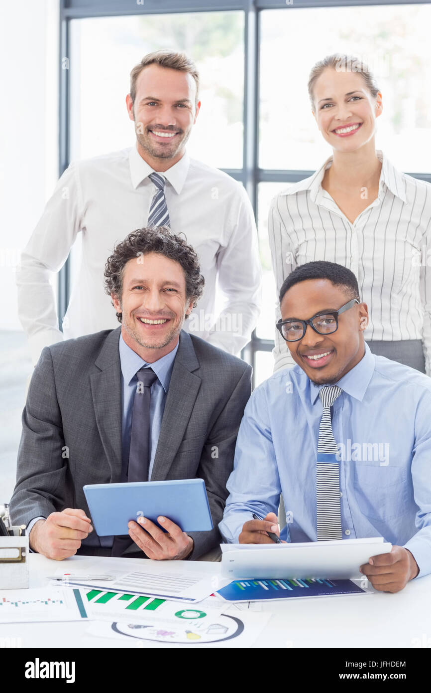 Portrait of happy business colleagues standing together Stock Photo - Alamy