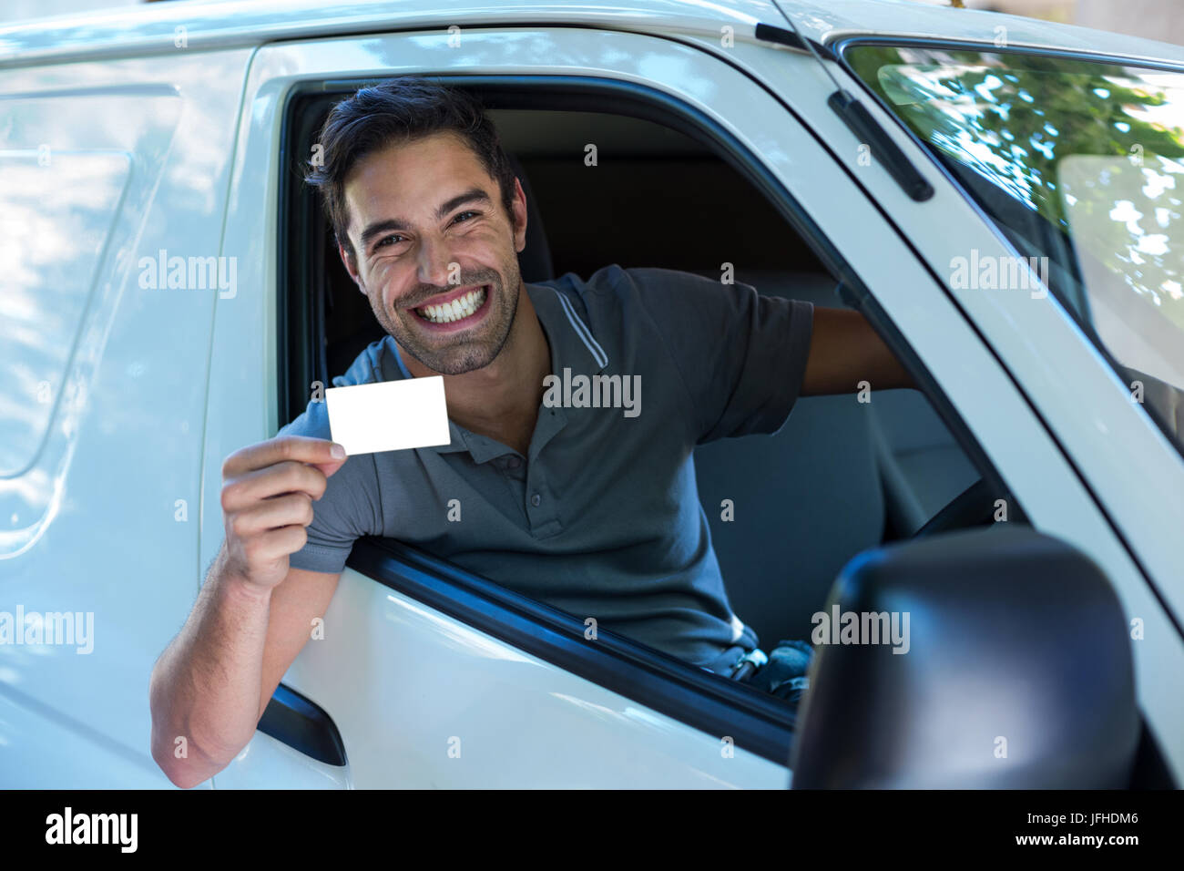 Handsome smiling worker driving hi-res stock photography and images - Alamy
