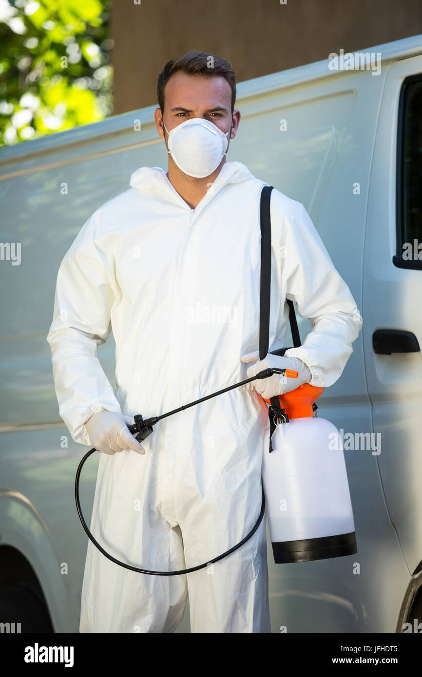 Portrait of pest control man standing next to a van Stock Photo - Alamy